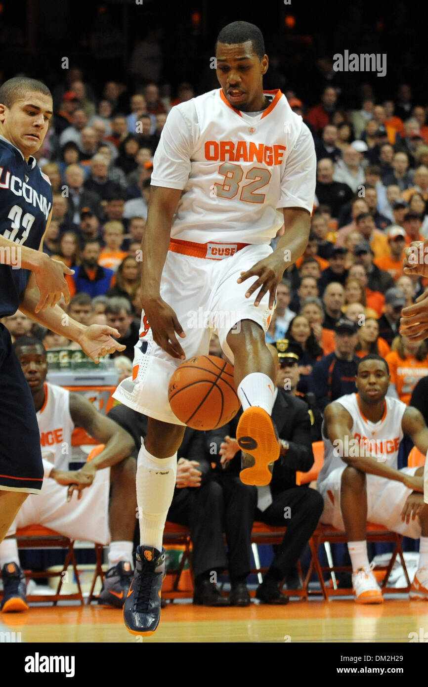 Syracuse forward Kris Joseph (32) flips the ball between the legs in an ...