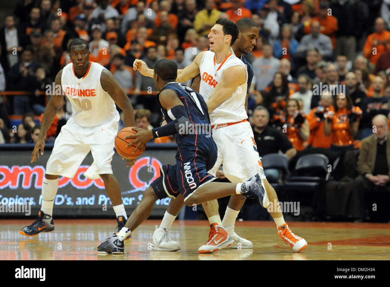 Connecticut guard Jerome Dyson (11) drives Syracuse guard Andy Rautins ...