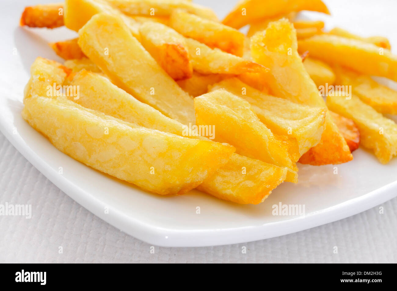 closeup of a plate with appetizing french fries on a set table Stock ...