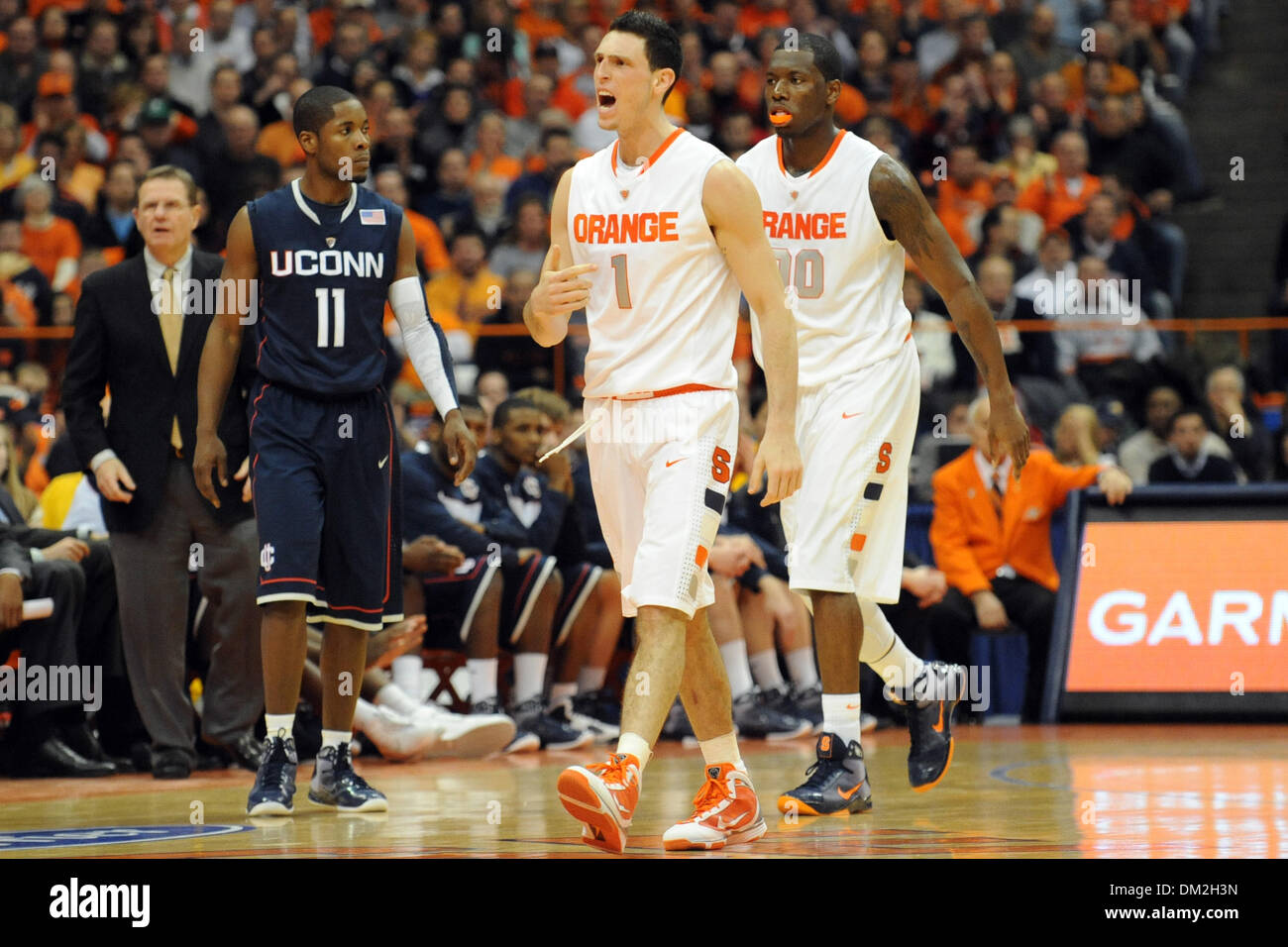 Syracuse guard Andy Rautins (1) yells back to the bench after picking ...