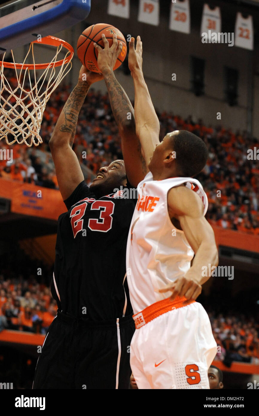Louisville forward Terrence Jennings (23) goes up for the dunk past ...