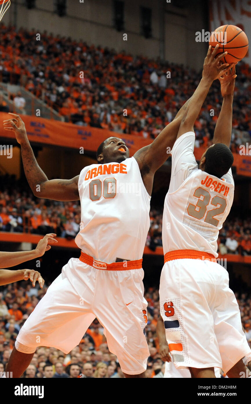 Syracuse forward Kris Joseph (32) pulls in the first half rebound away ...
