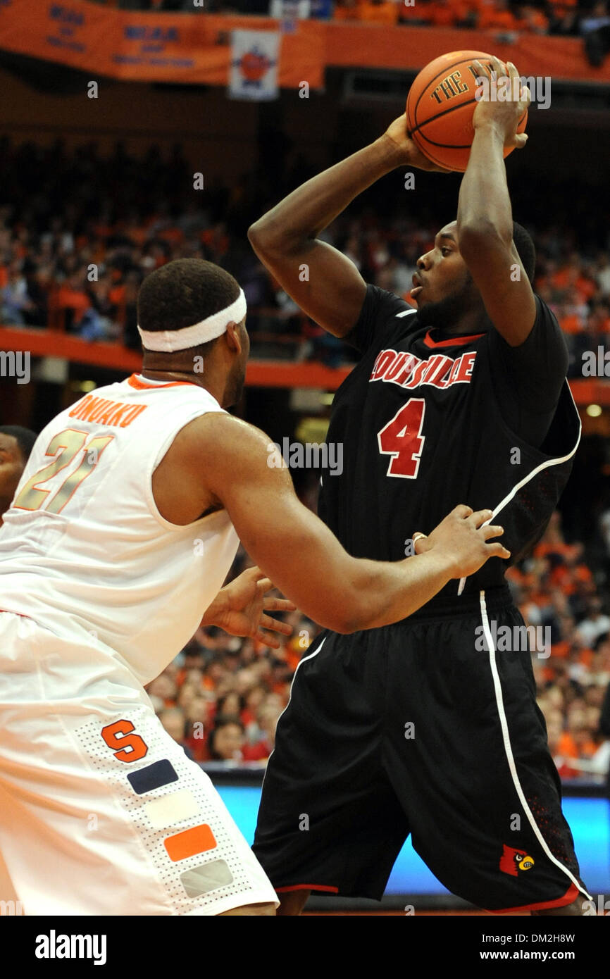 Louisville forward Rakeem Buckles (4) looks for a place to pass the ...