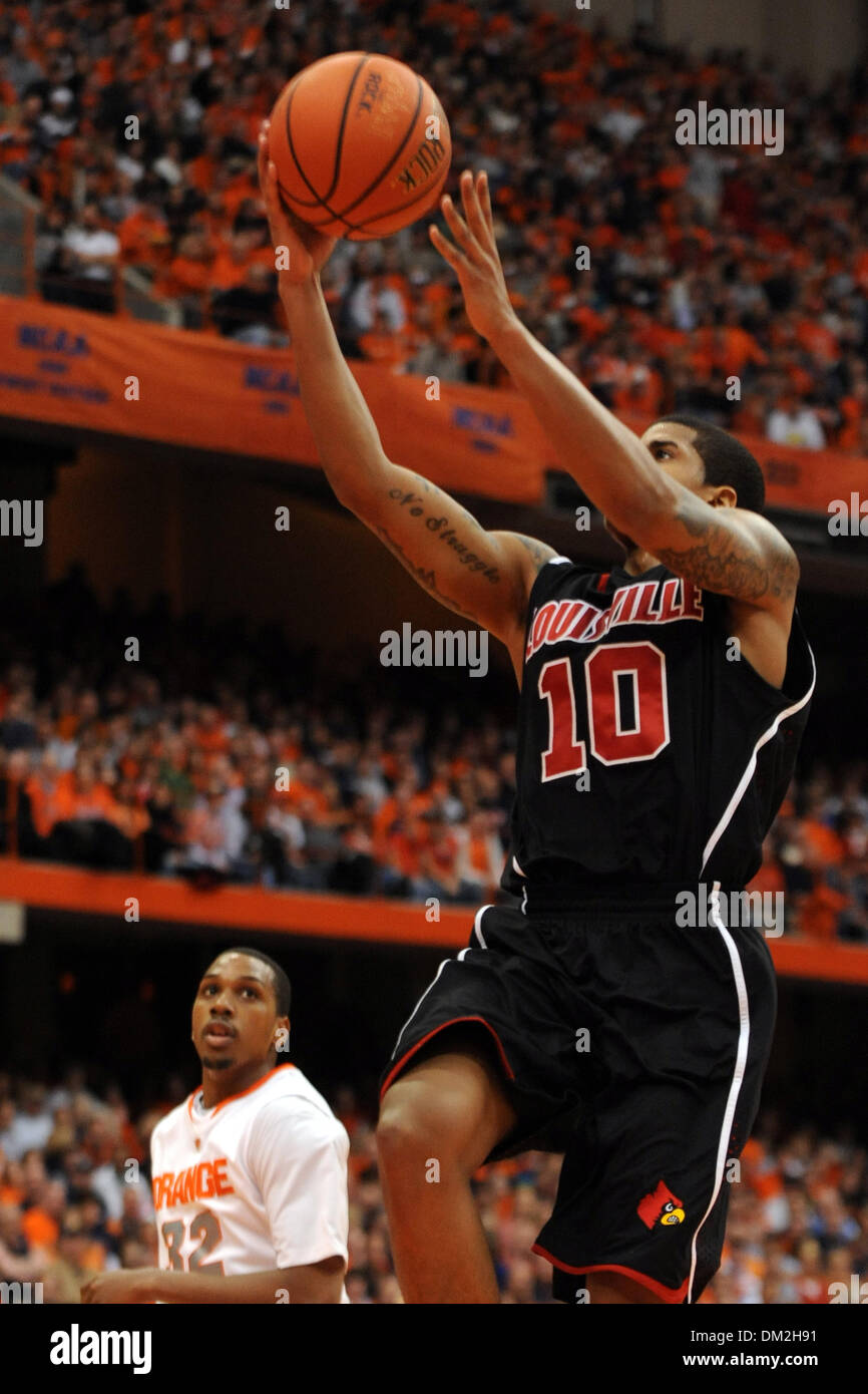 Louisville guard Edgar Sosa soars to the rim for the first half basket ...