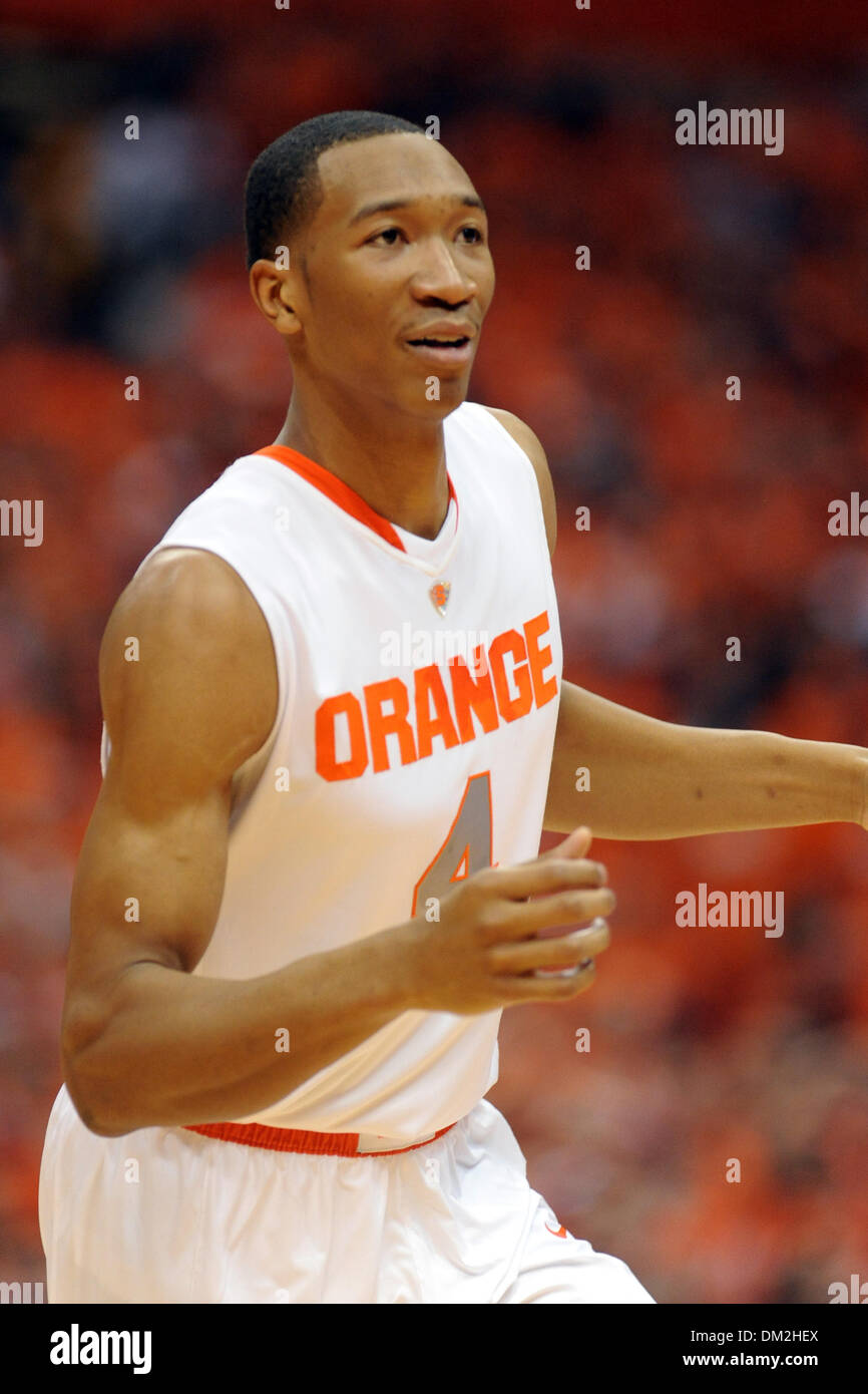 Syracuse forward Wesley Johnson (4) gets back on defense after scoring ...