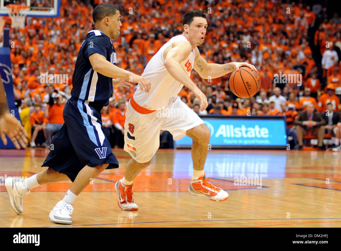 Syracuse guard Andy Rautins (1) drives the ball past Villanova guard ...