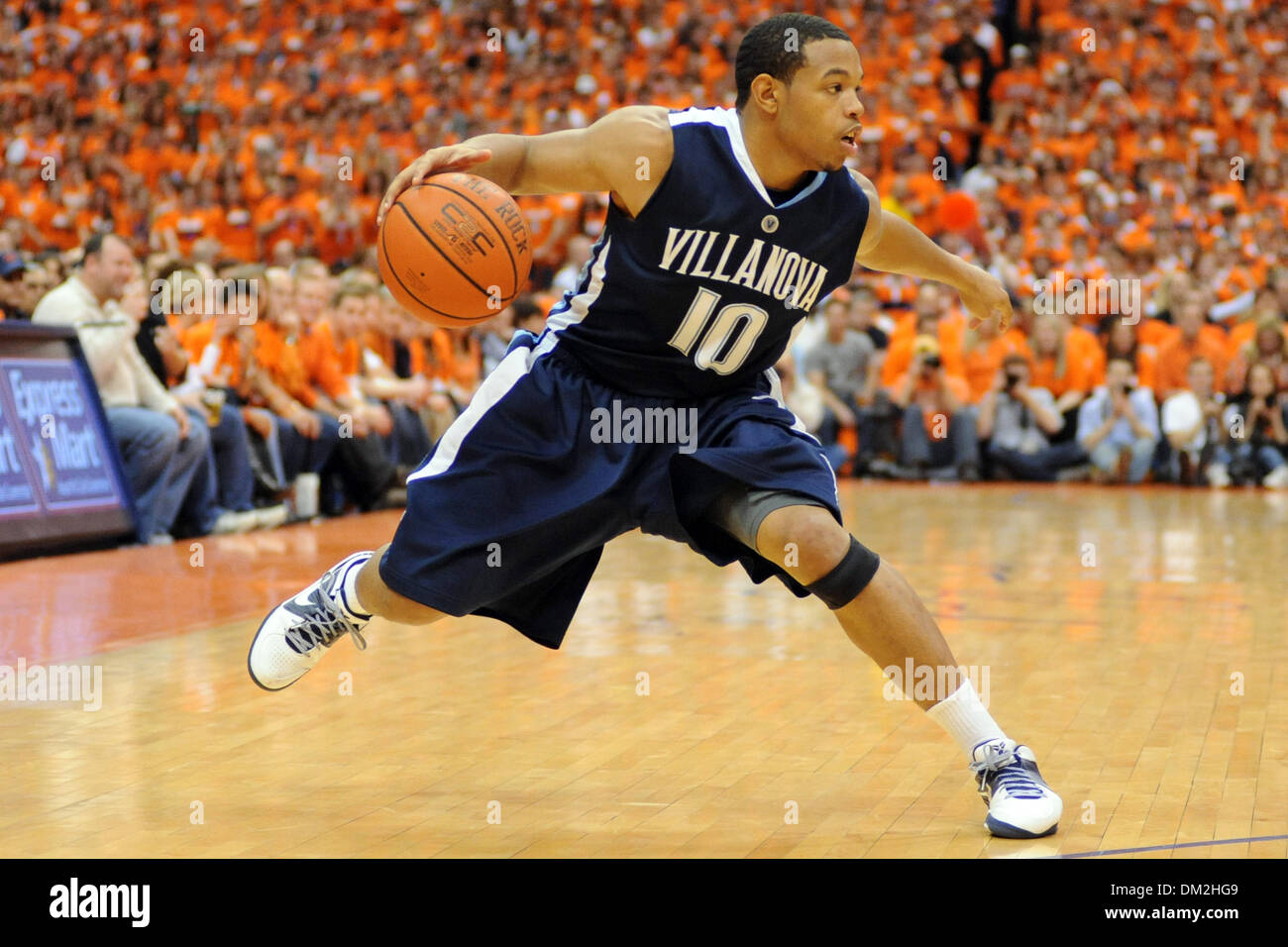 Villanova guard Corey Fisher (10) tries to hold back instead of driving ...