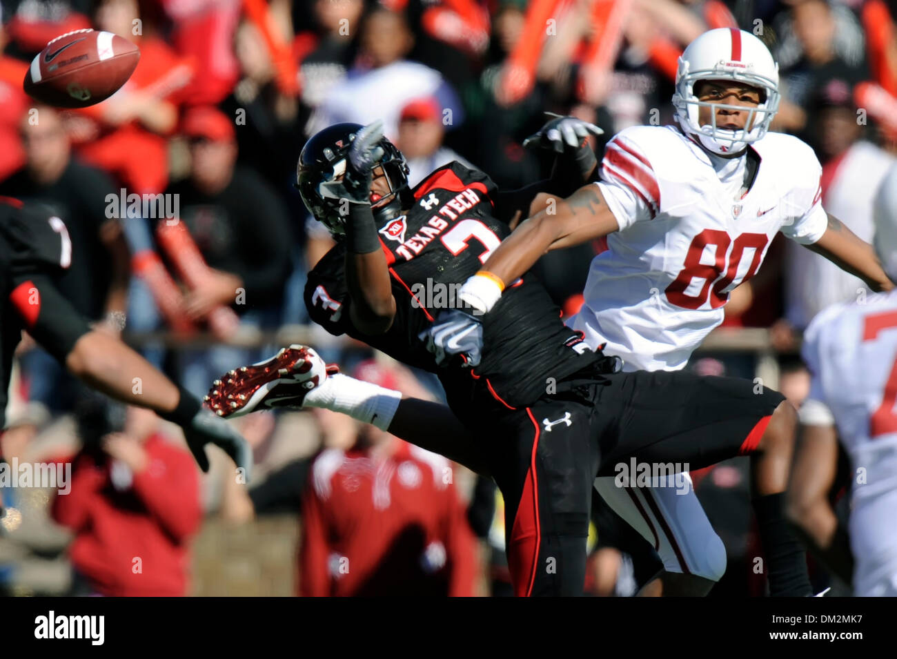 Oklahoma's WR Adron Tennell is defended by Texas Tech's CB Jamar Wall ...