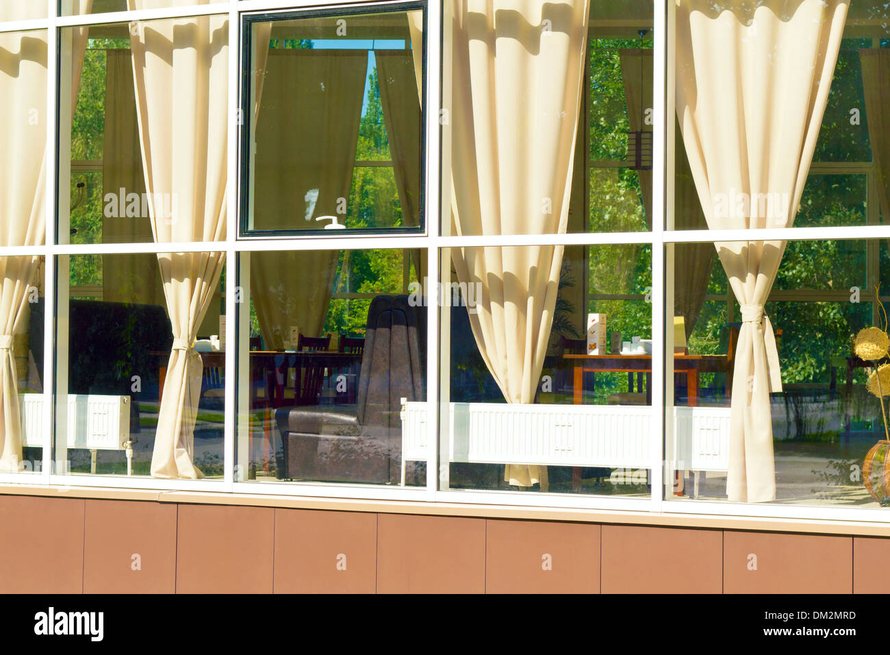 view from the street through a window at the interior of the cafe Stock ...