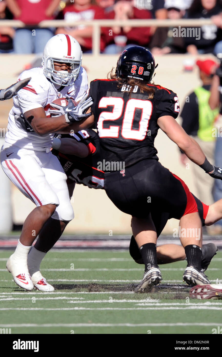 Texas Tech LB Bront Bird (20) looks to stop RB Demarco Murray (7) as ...