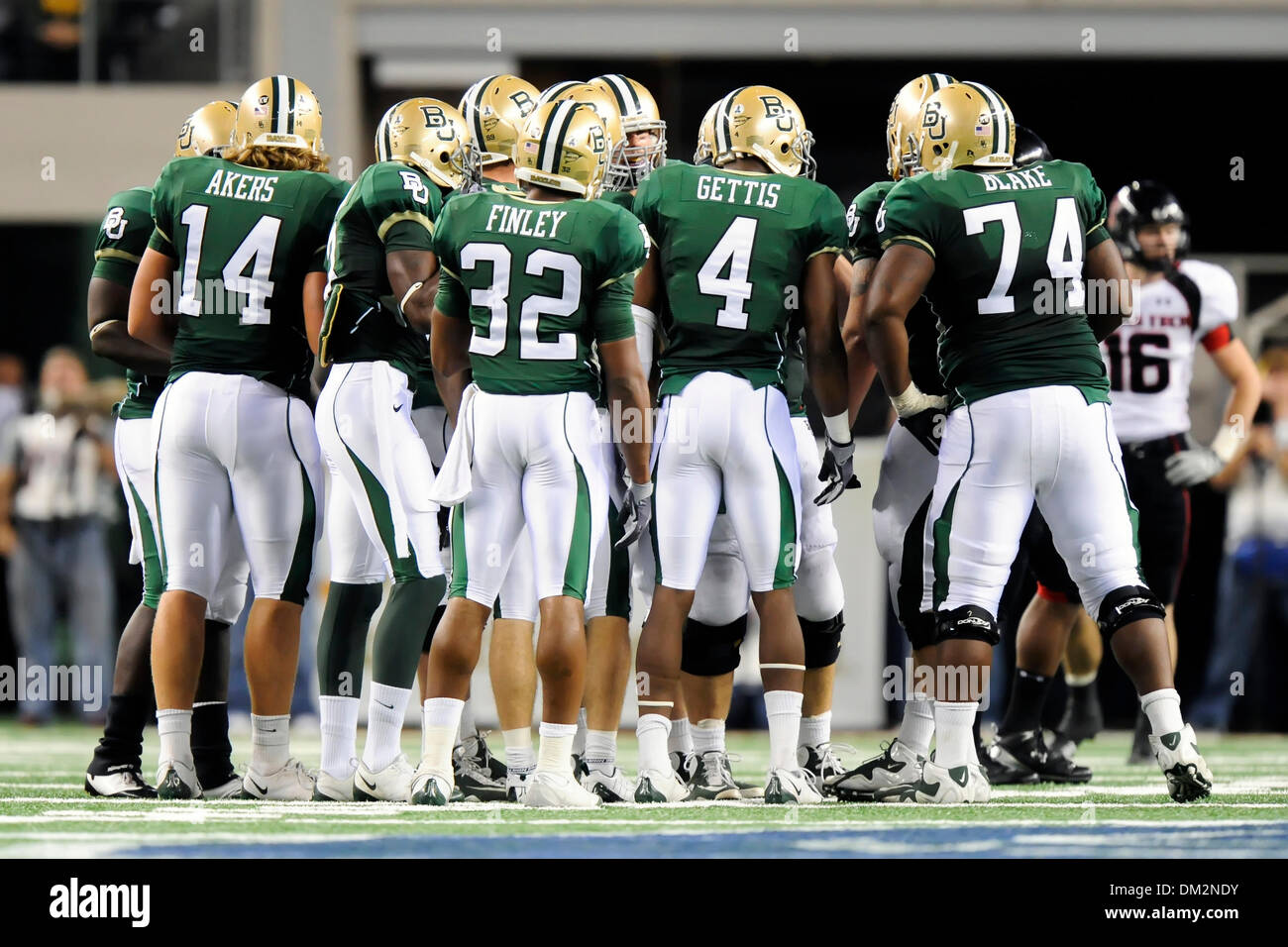 The Baylor offensive unit huddles as the Baylor Bears and the Texas ...
