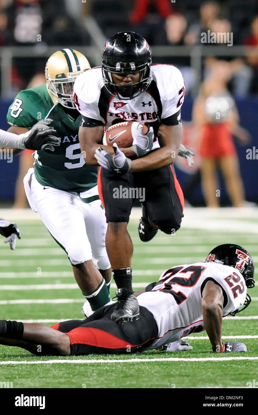 Texas Tech RB Eric Stephens (24) blasts through the line of scrimmage ...