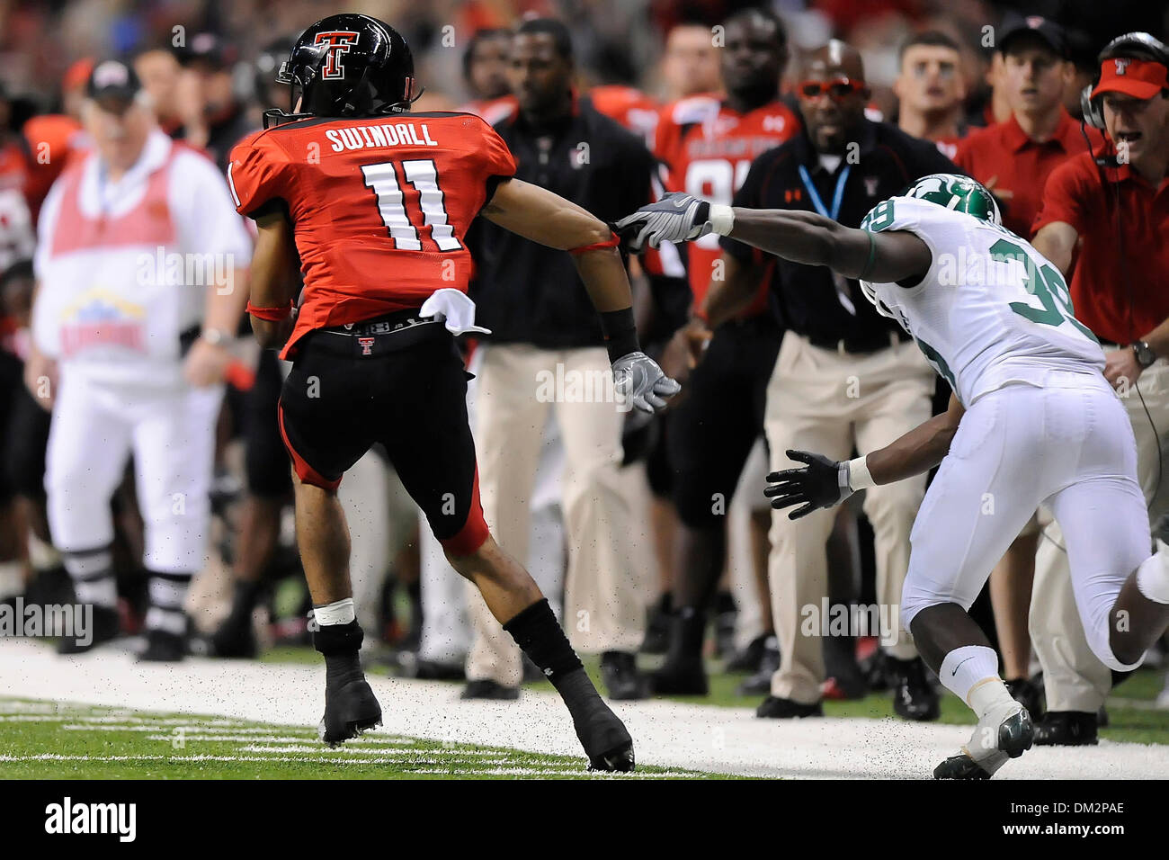 Texas Tech wide receiver Tramain Swindall (11) makes the reception down ...