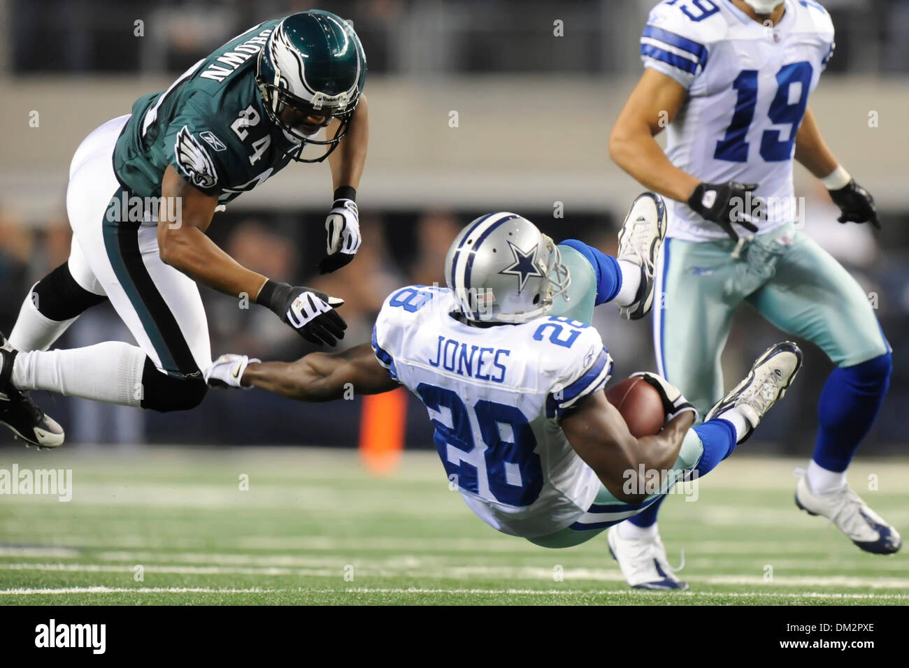 Dallas Cowboys running back Felix Jones (28) is hit hard by ...