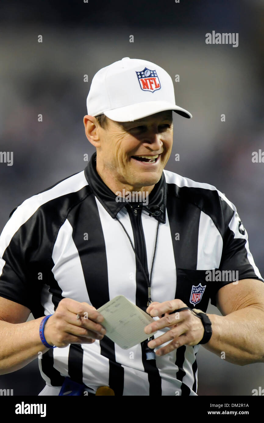 NFL official Ed Hochuli laughs during a tv timeout in first half action ...