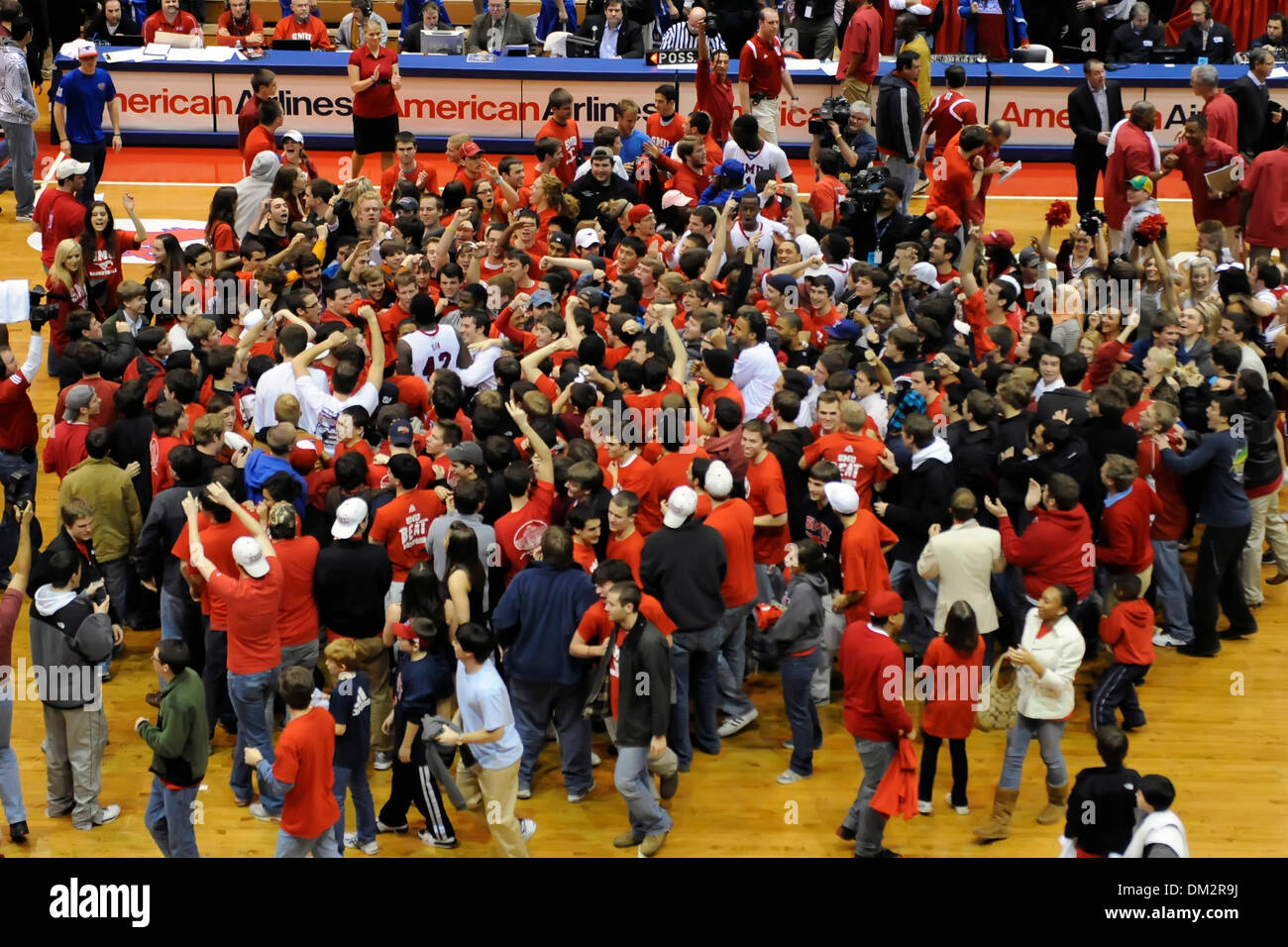 SMU fans rush the court after defeating the Memphis Tigers at Moody ...