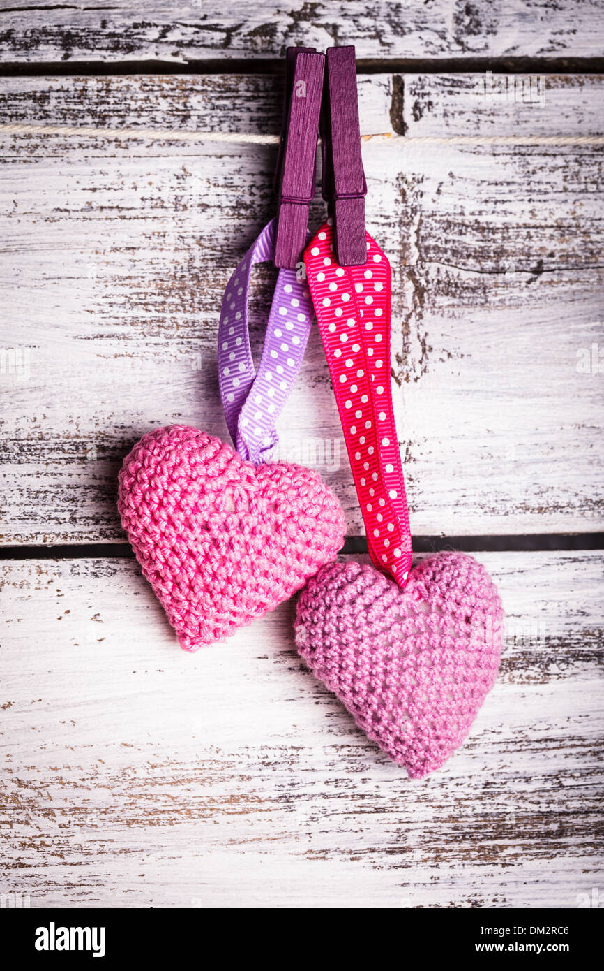 Crochet valentine hearts handing on the rope. Valentine's day greeting ...