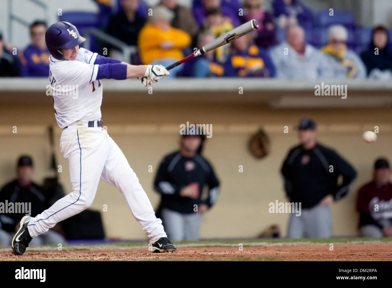 Centenary at LSU; LSU infielder Tyler Hanover (11) connects with a ...