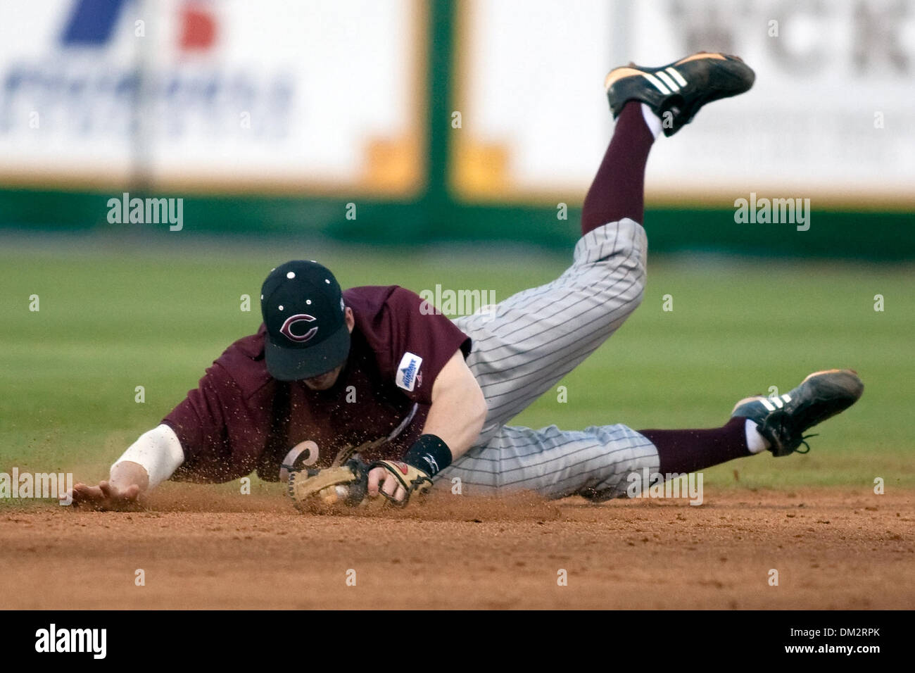 Centenary at LSU; Centenary shortstop Alex Todd dives for a ball hit ...