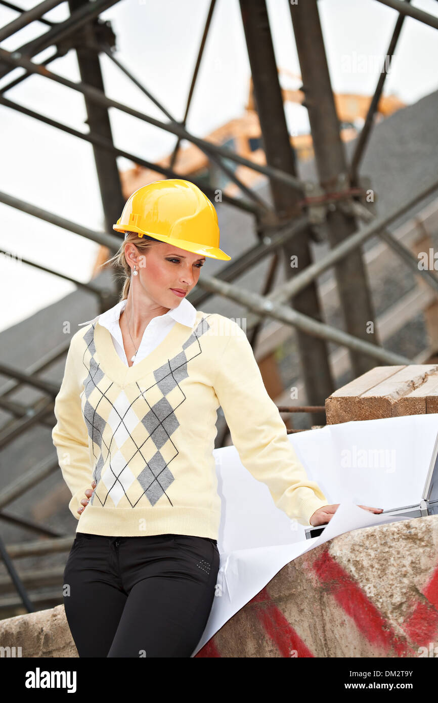 A young female constructor at building of a new motorway in Germany ...