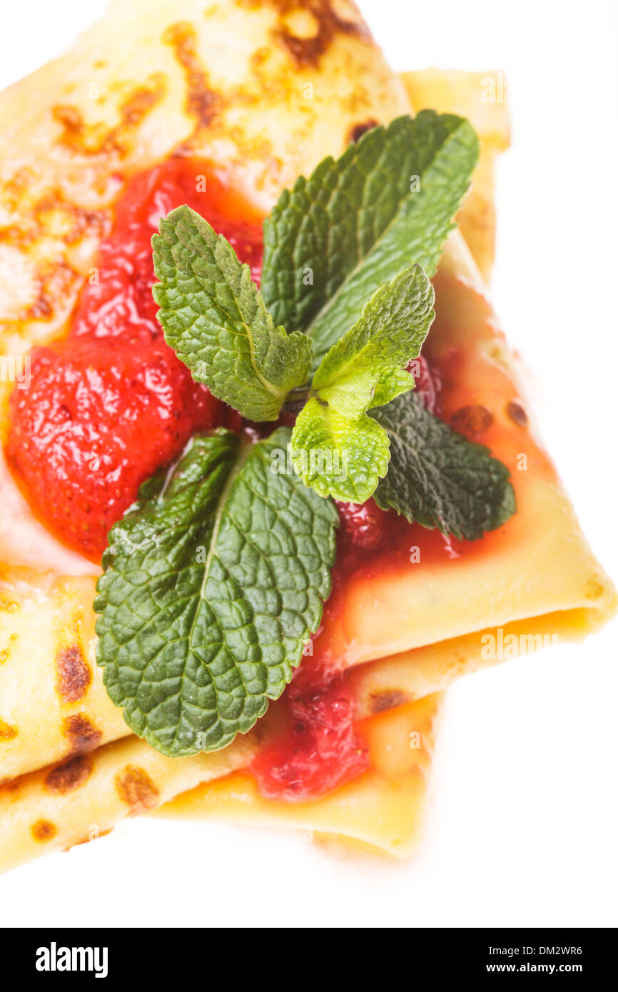 Crepes with strawberry jam and mint isolated on white background Stock ...