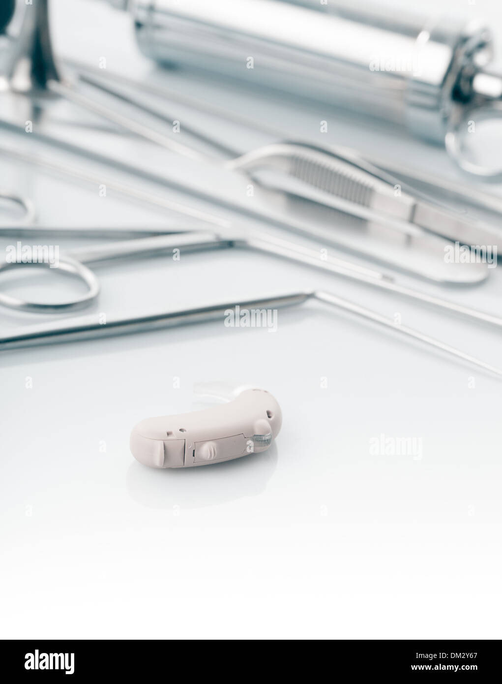 Medical instruments for ENT doctor on white and hearing aid ...