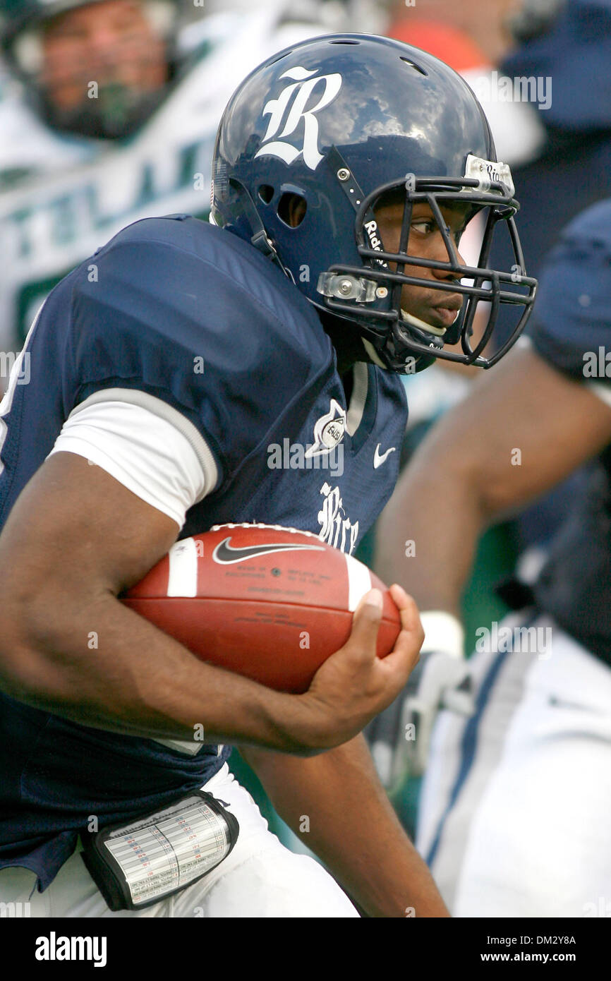 Rice running back Charles Ross (28) has a blocker and is gaining ...