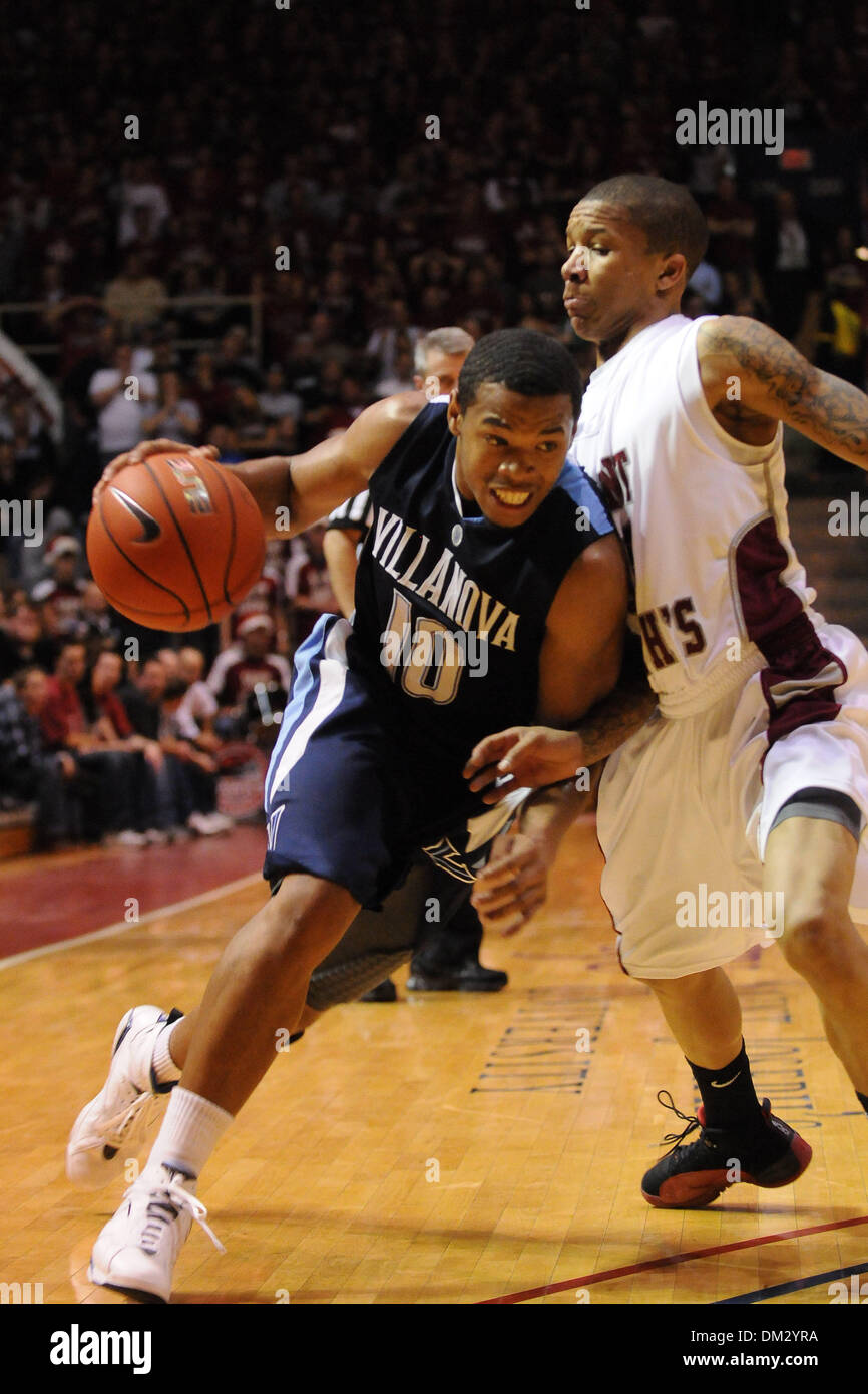 Villanova Guard Corey Fisher #10 drives against St. Josephs Guard ...