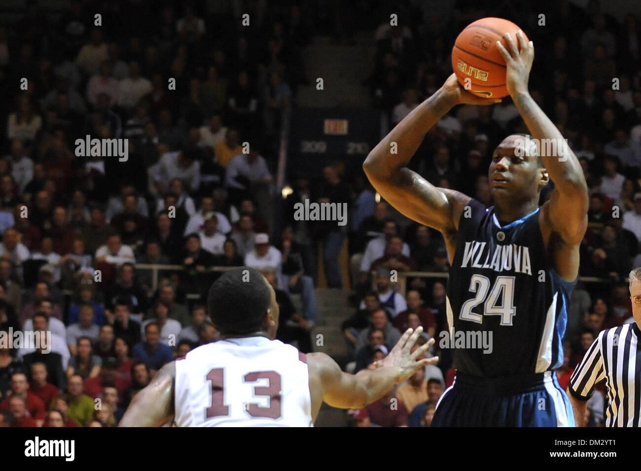 Villanova Guard Corey Stokes #24 passes over St. Josephs Guard Darrin ...