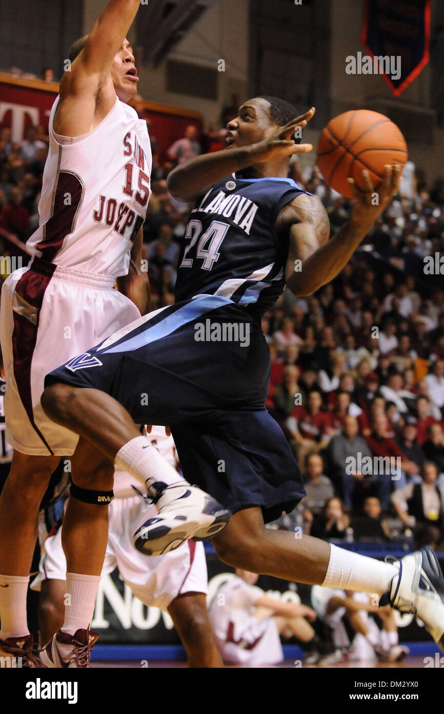 Villanova Guard Corey Stokes #24 drives against St. Josephs Guard ...