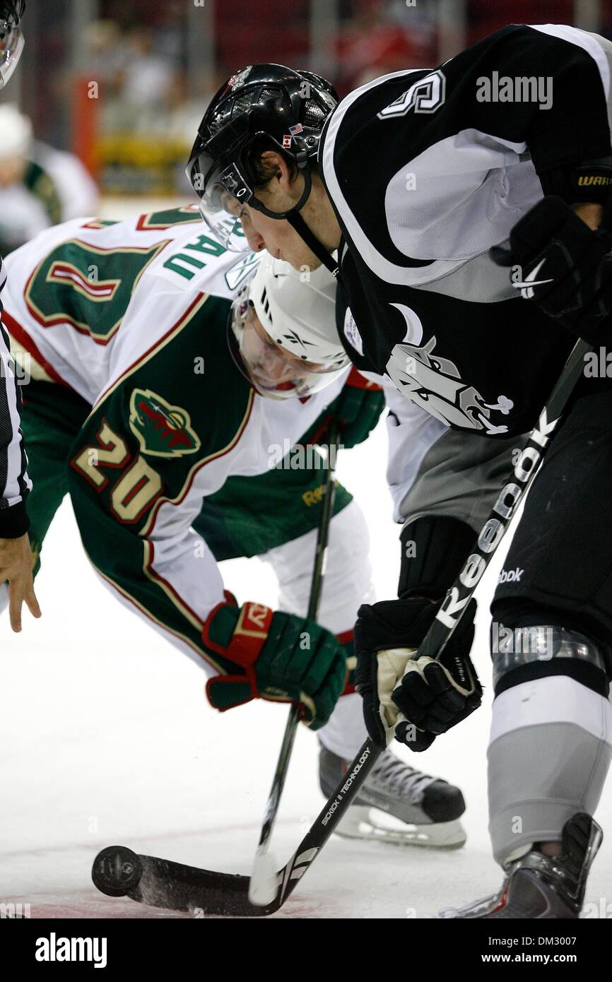 Houston Aeros Center Chad Rau (20) faces off against San Antonio ...