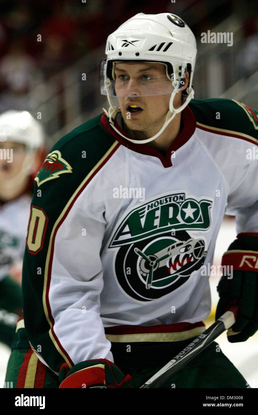 Houston Aeros Center Chad Rau (20) looks for a pass at the red line ...