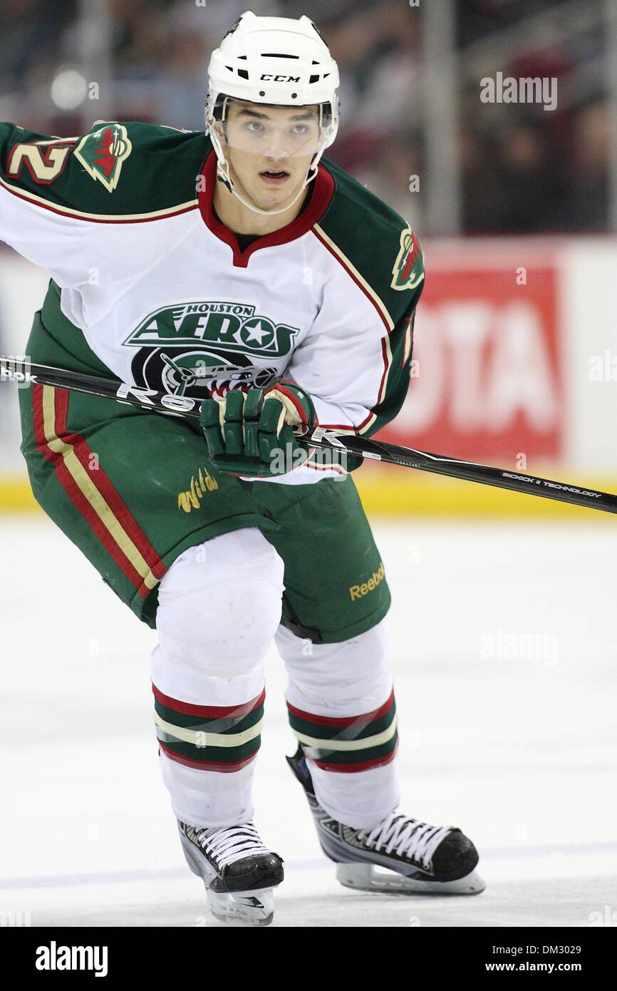 Houston Aeros Center Cody Almond (12) crosses the blue line as the ...