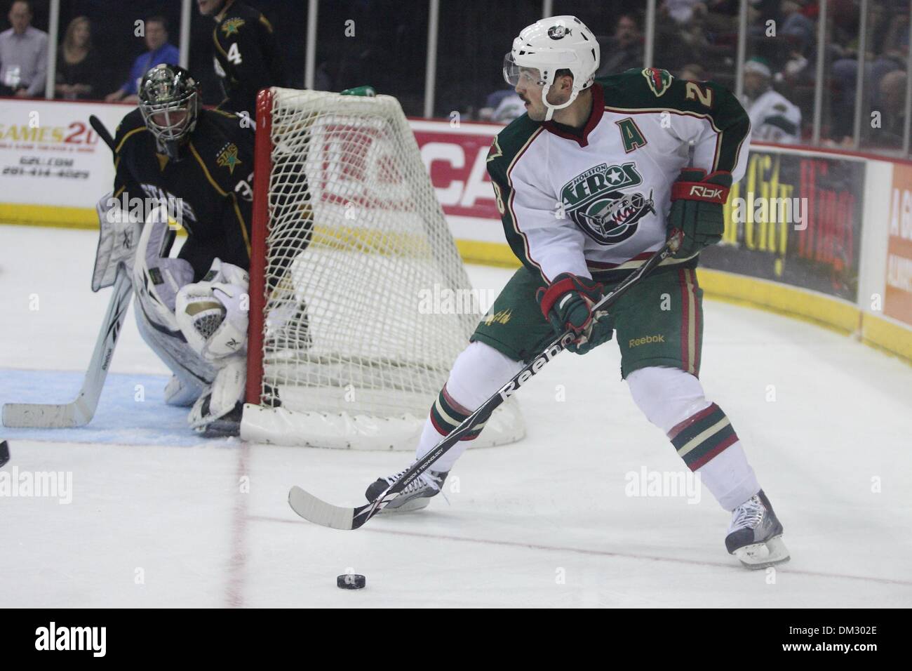 Houston Aeros Defenseman Brandon Rogers (28) keeps the pressure on the ...
