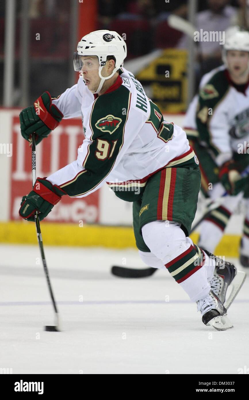 Houston Aeros Center Andy Hilbert (91) bigins the attack as he clears ...