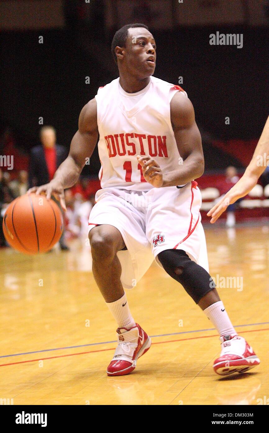 University of Houston Guard Desmond Wade (11) controls the ball and ...