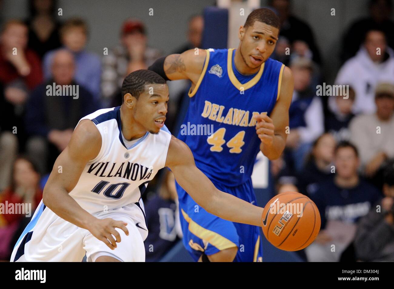 Villanova guard Corey Fisher #10 brings the ball up court past Delaware ...