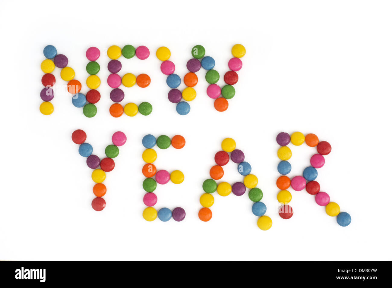 The title NEW YEAR written of the colored smarties. Festive theme Stock ...