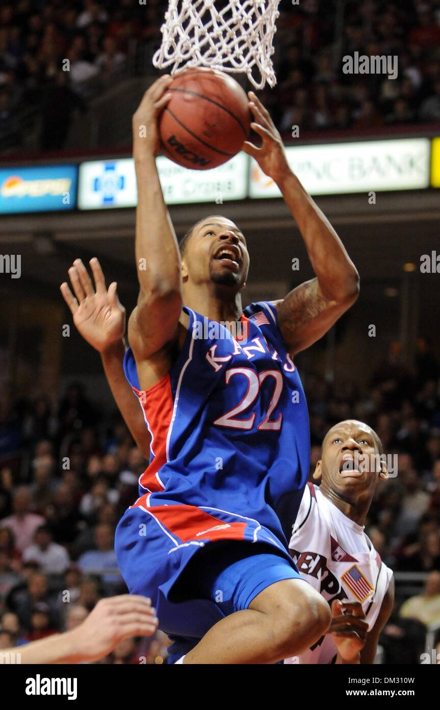 Kansas forward Marcus Morris #22 drives over Temple guard Ryan Brooks ...