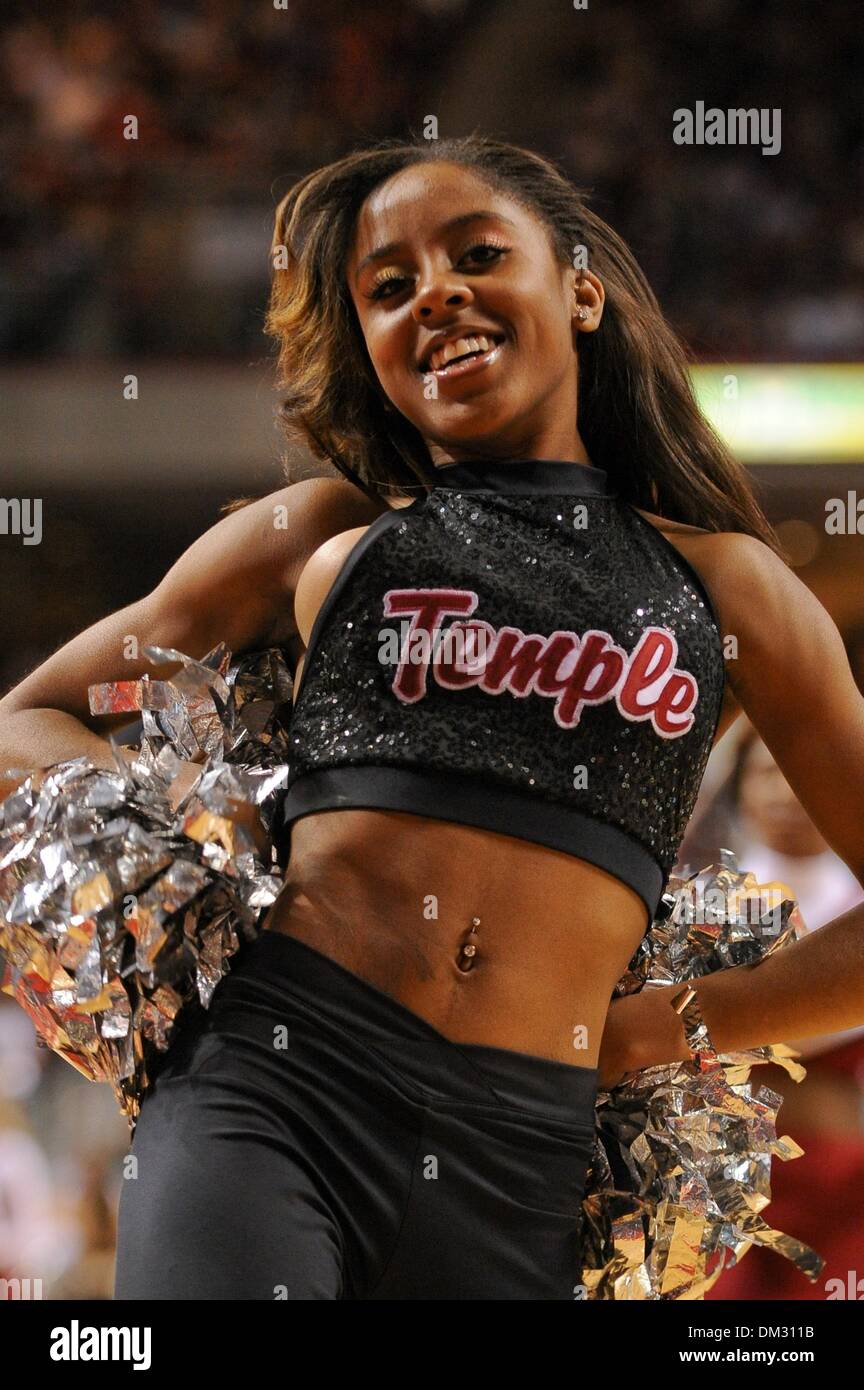 A member of the Temple dance team performs during a timeout in a game ...