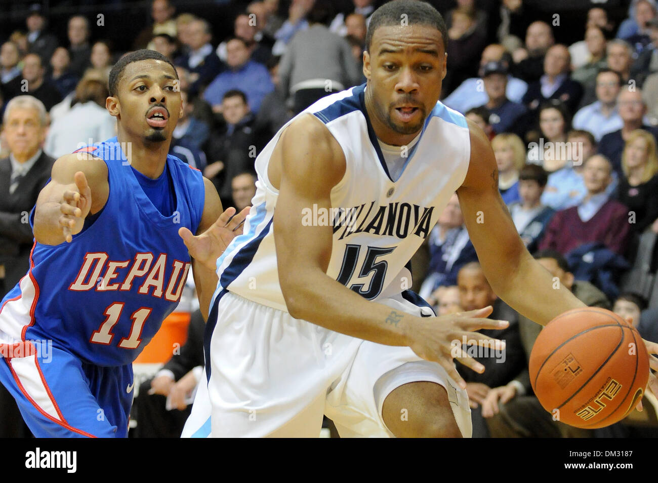 Villanova guard Reggie Redding #15 drives past DePaul guard Jeremiah ...