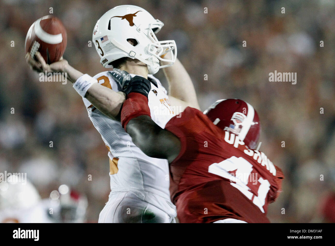 Texas quarterback Garrett Gilbert (3) is hit by Alabama linebacker ...