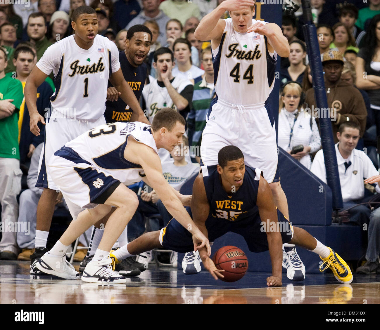 Notre Dame Forward Luke Harangody (44) and West Virginia Forward ...