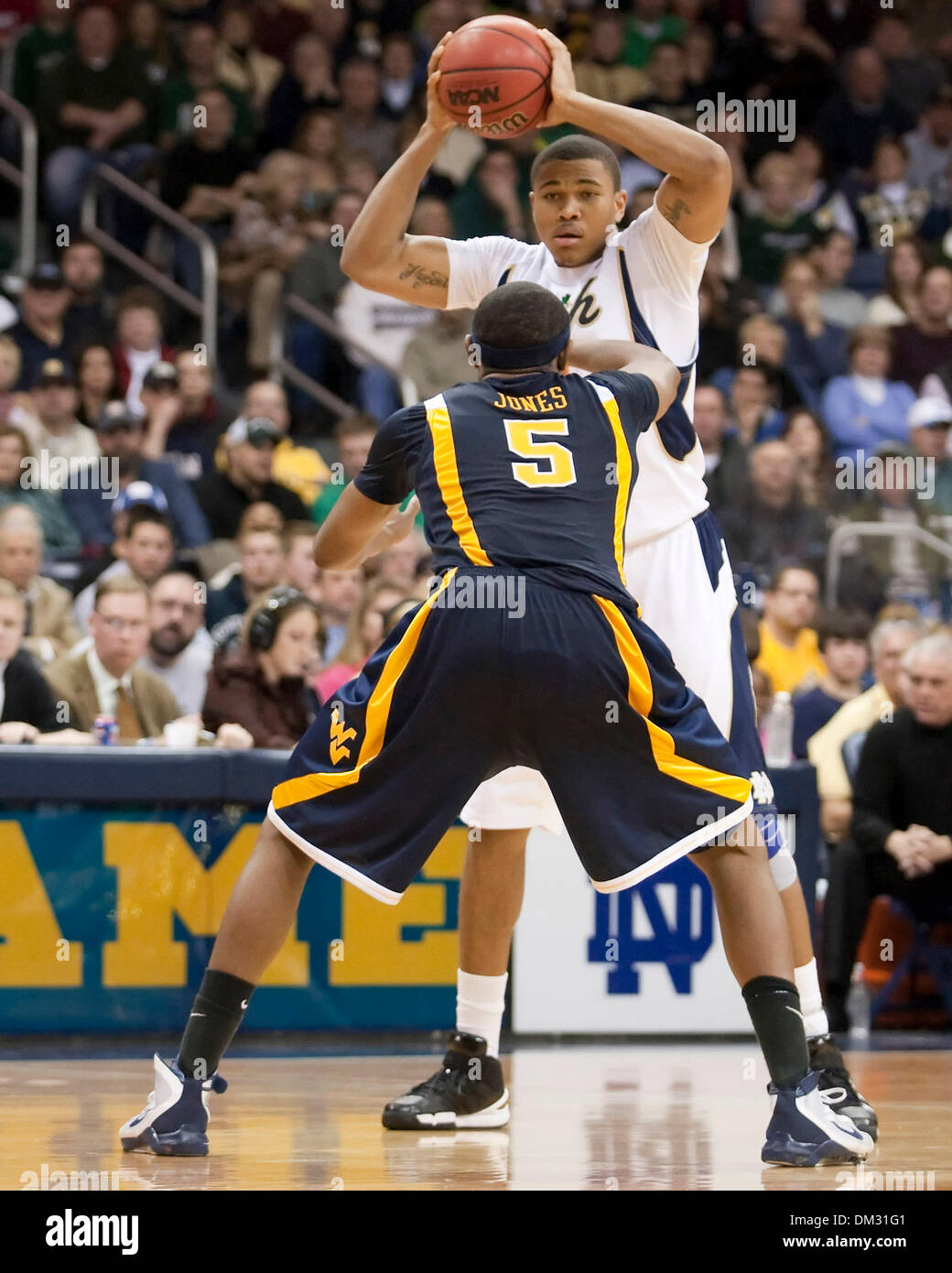 Notre Dame Forward Tyrone Nash (1) and West Virginia Forward Kevin ...