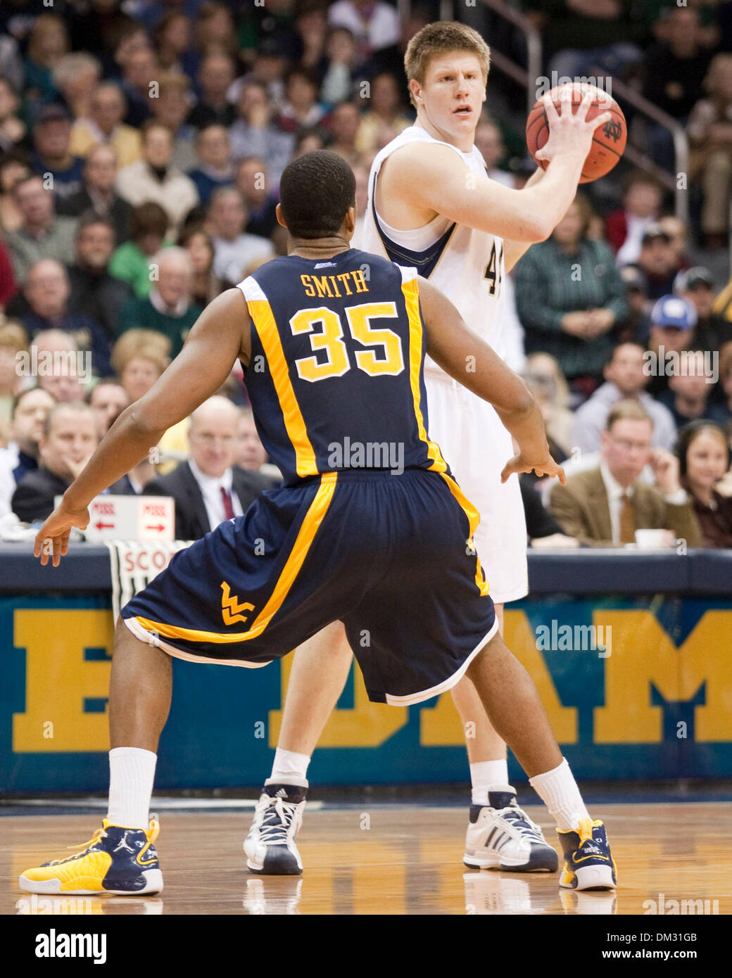 Notre Dame Forward Luke Harangody (44) and West Virginia Forward ...