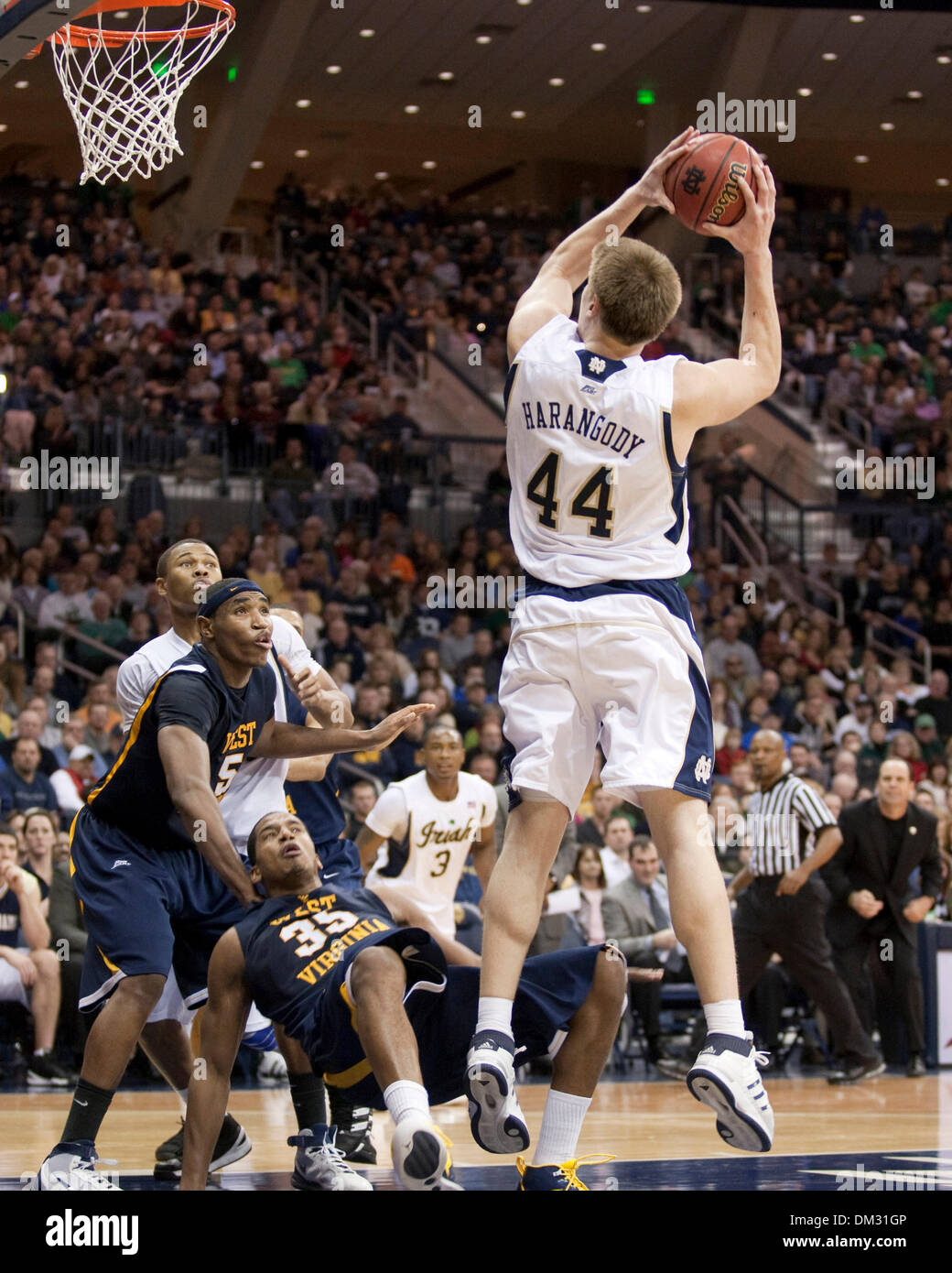 Notre Dame Forward Luke Harangody (44) and West Virginia Forward ...