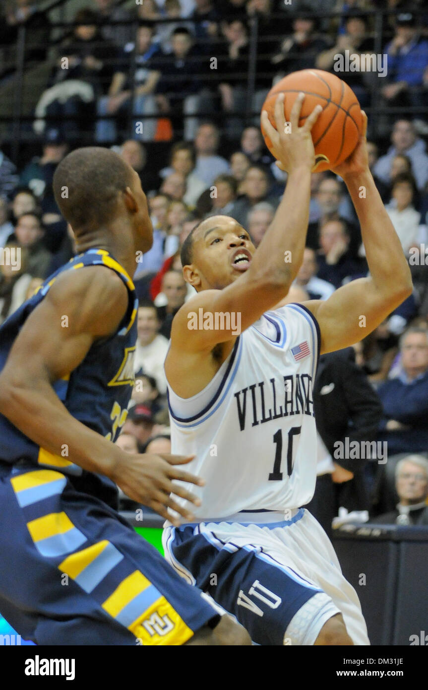 Villanova guard Corey Fisher #10 drives to the basket past Marquette ...