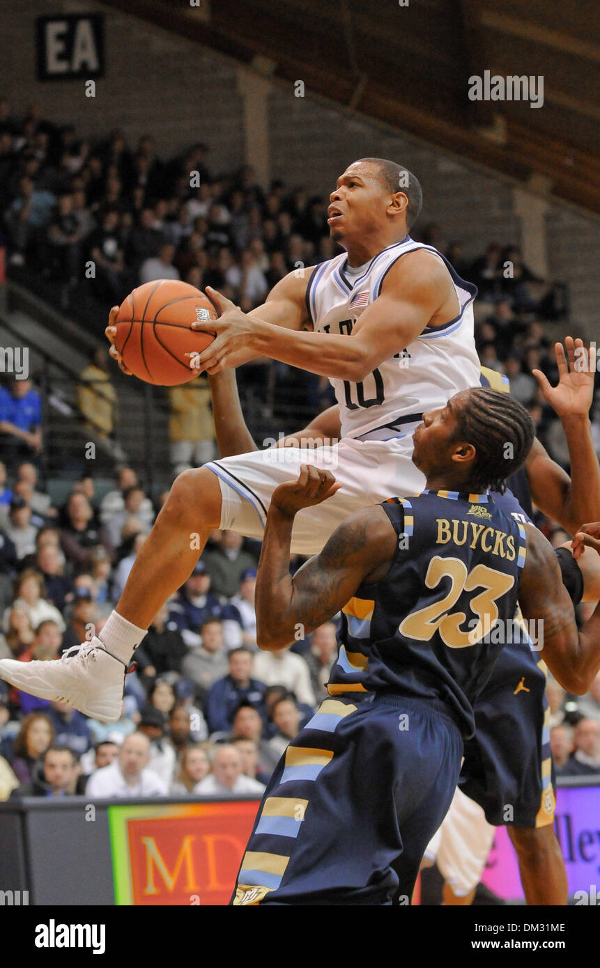 Villanova guard Corey Fisher #10 glides on his way to the basket past ...