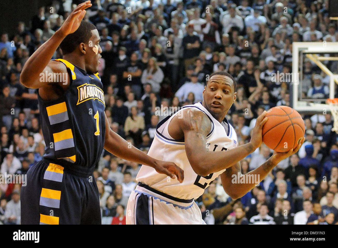 Villanova guard Corey Stokes #24 with the ball being defended by ...
