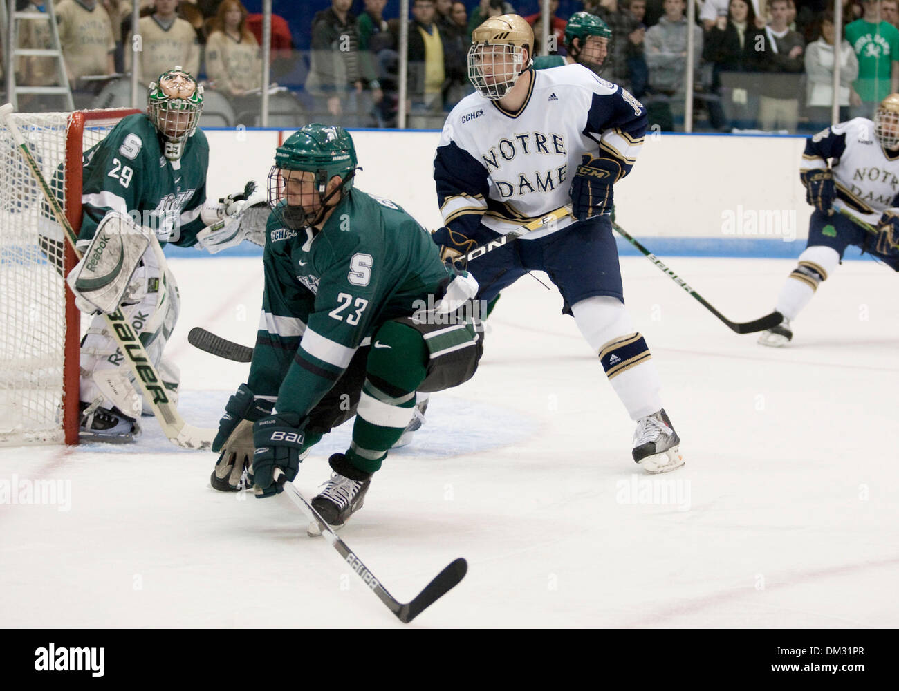 Michigan State Defenseman Matt Grassi (23) and Notre Dame Right Wing ...